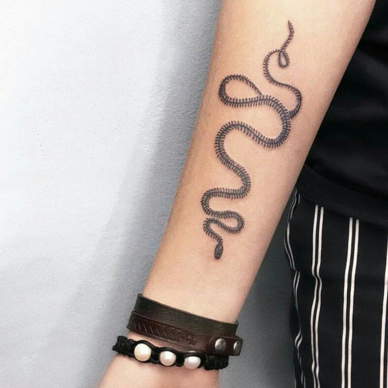15 Snake Skeleton Tattoo Designs & Ideas - PetPress